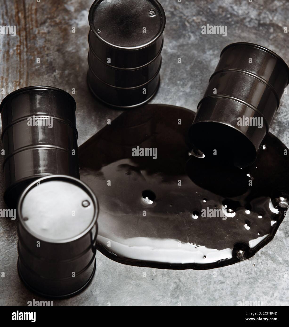 High angle view on four fuel drums with spilled oil Stock Photo - Alamy
