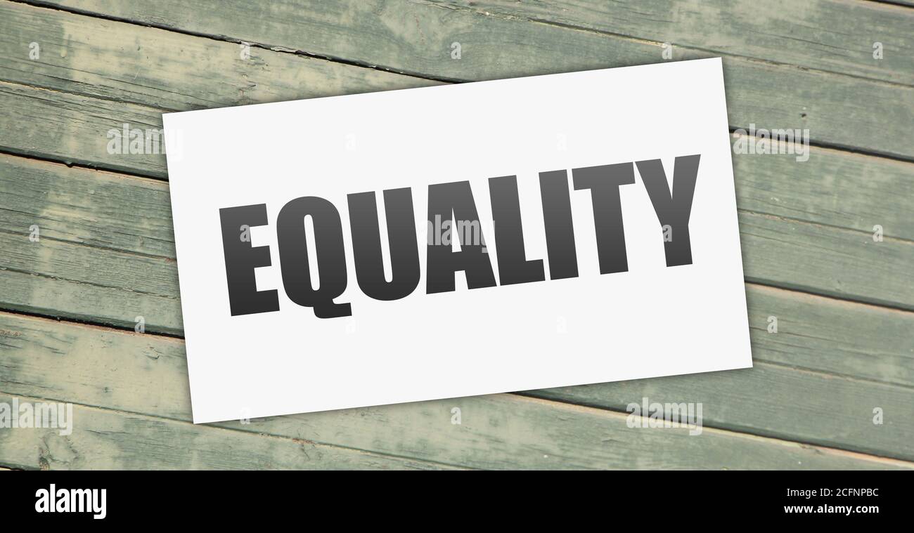 Equality word on card on grunge wooden background. social diversity ...