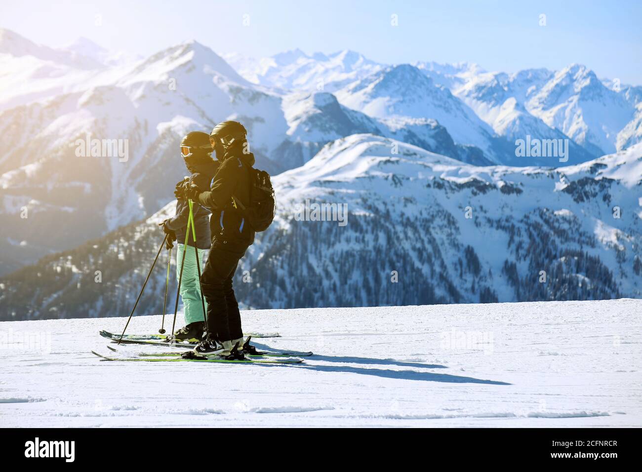 Two skiers enjoy the view Stock Photo - Alamy