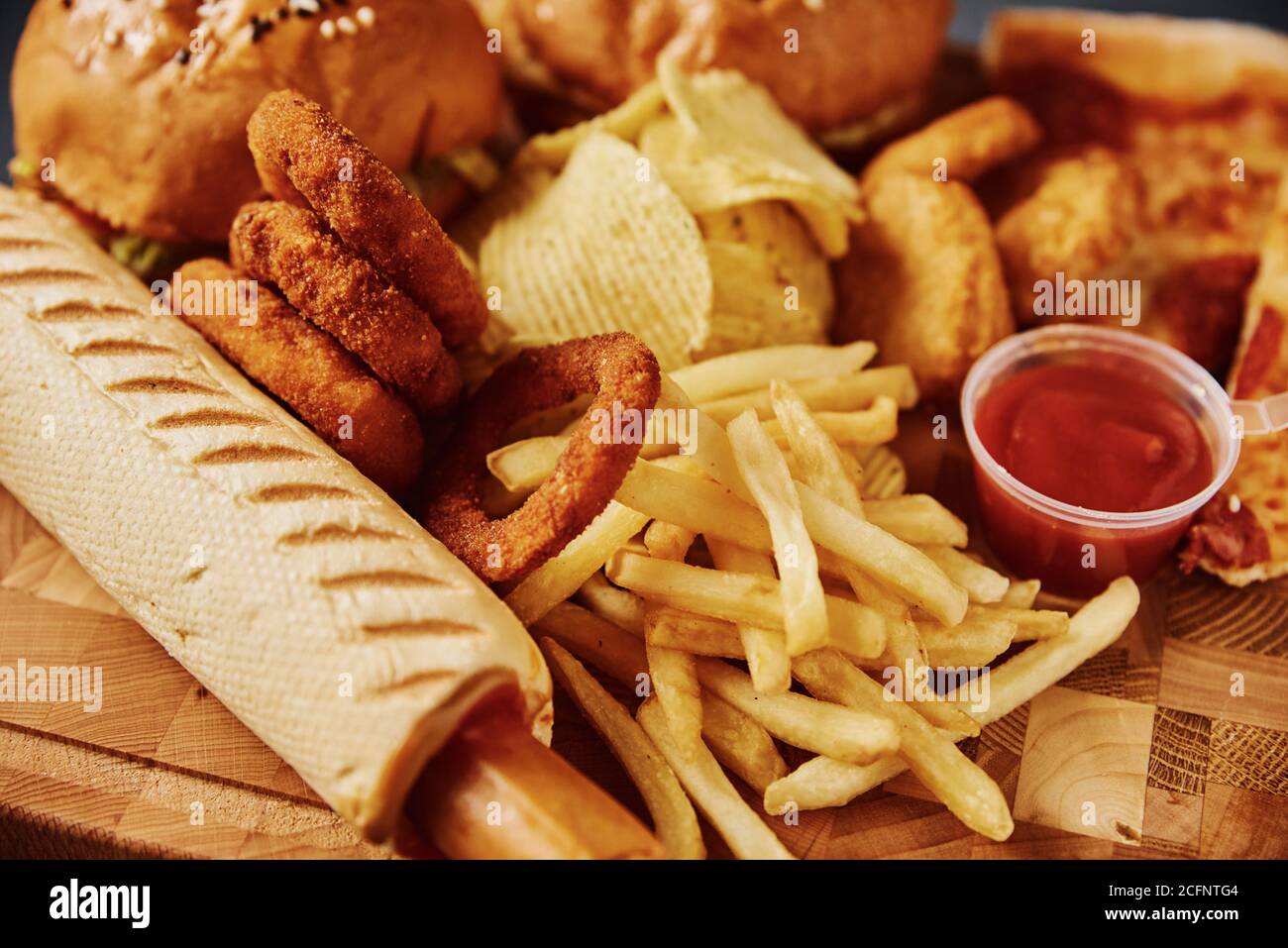Unhealthy and junk food. Different types of fast food on the table ...