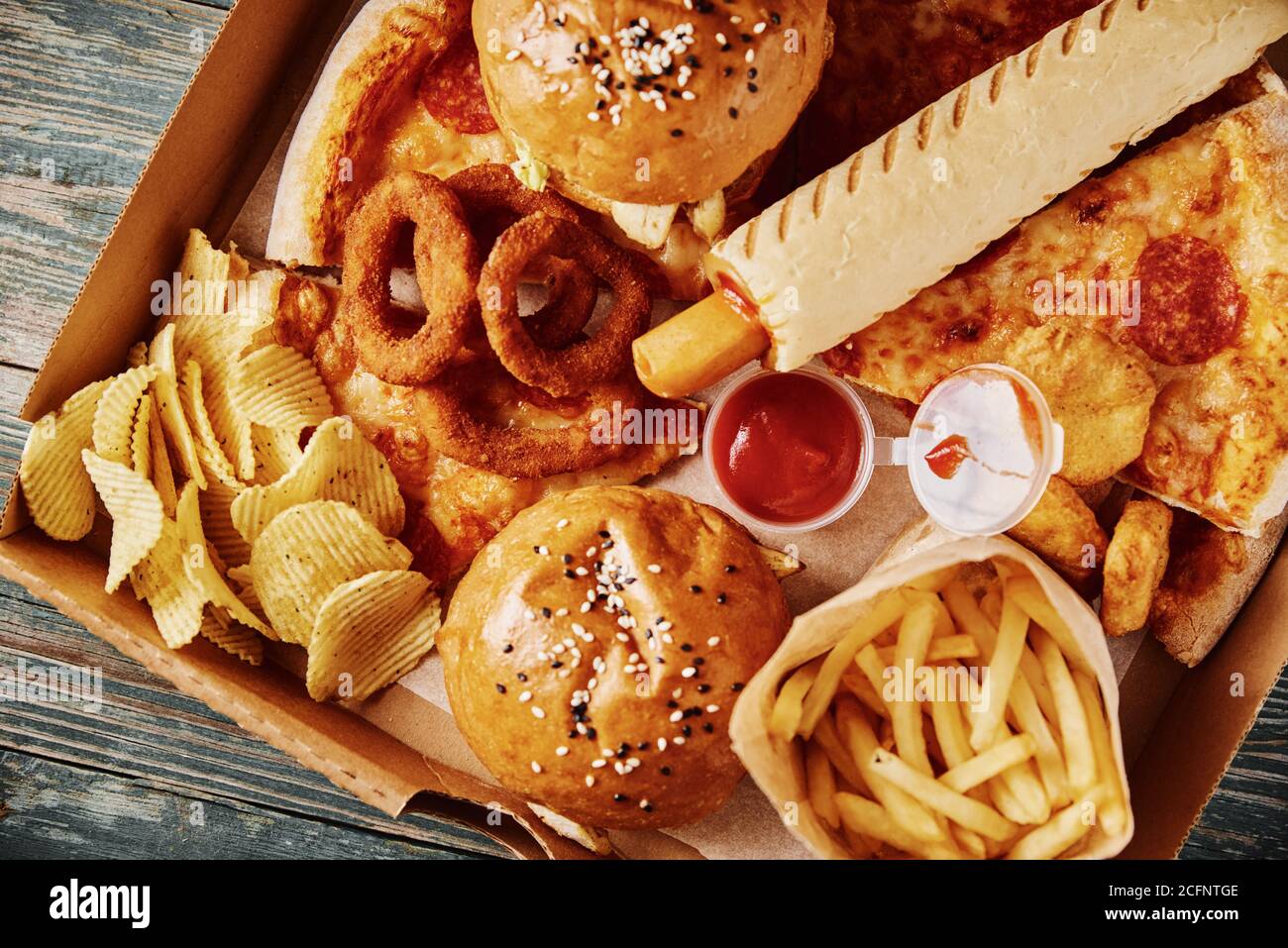 Unhealthy and junk food. Different types of fast food on the table ...
