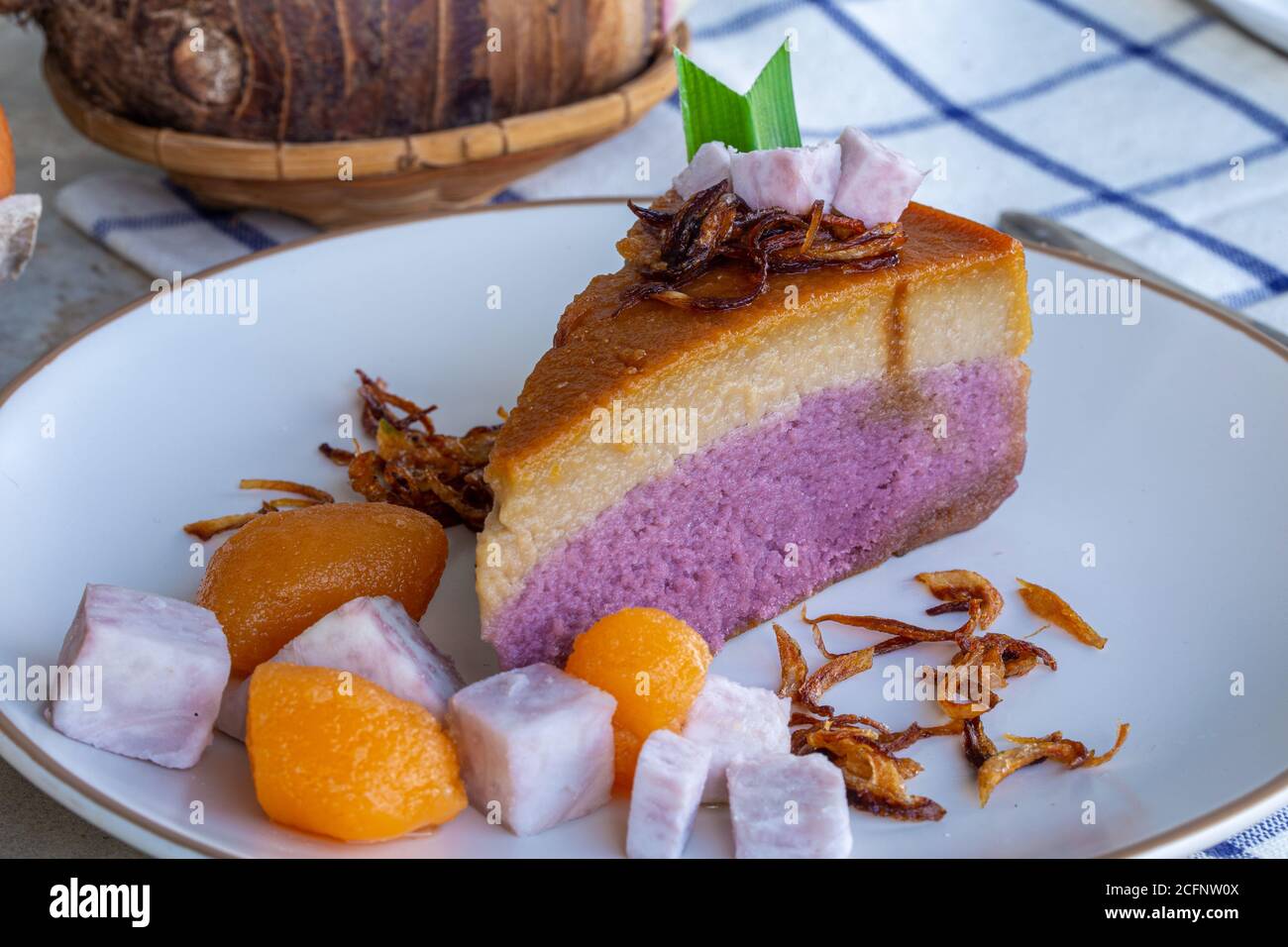 close-up of taro chiffon cake topped with Thai taro custard and fried ...