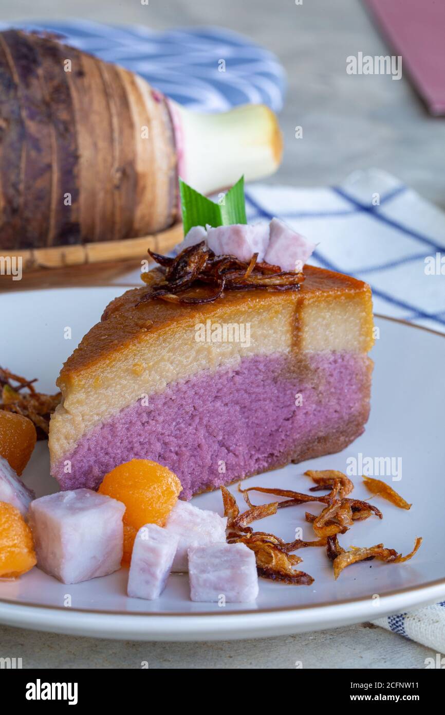 close-up of taro chiffon cake topped with Thai taro custard and fried ...
