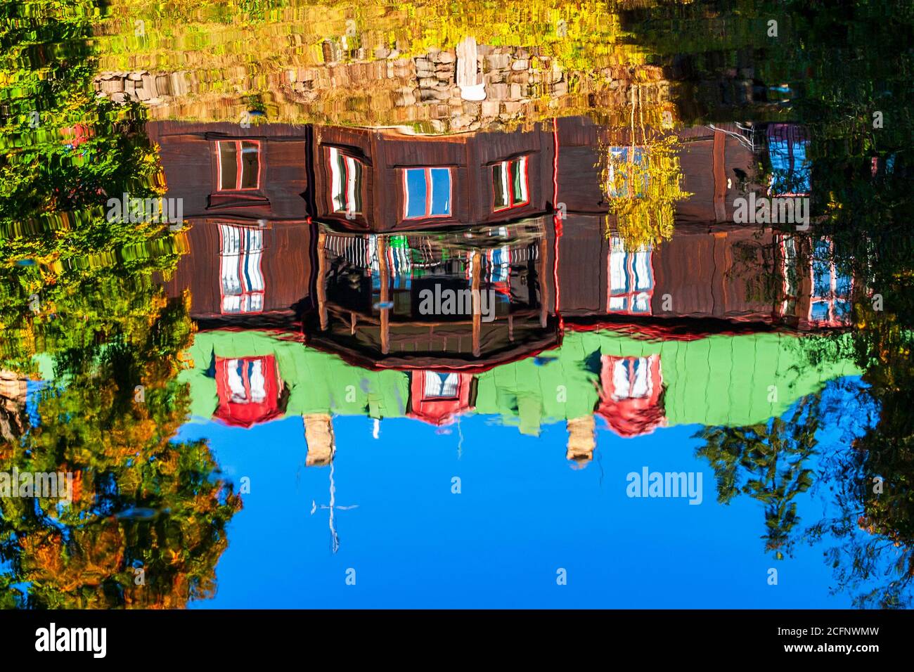 Old manor house reflection in the water Stock Photo - Alamy
