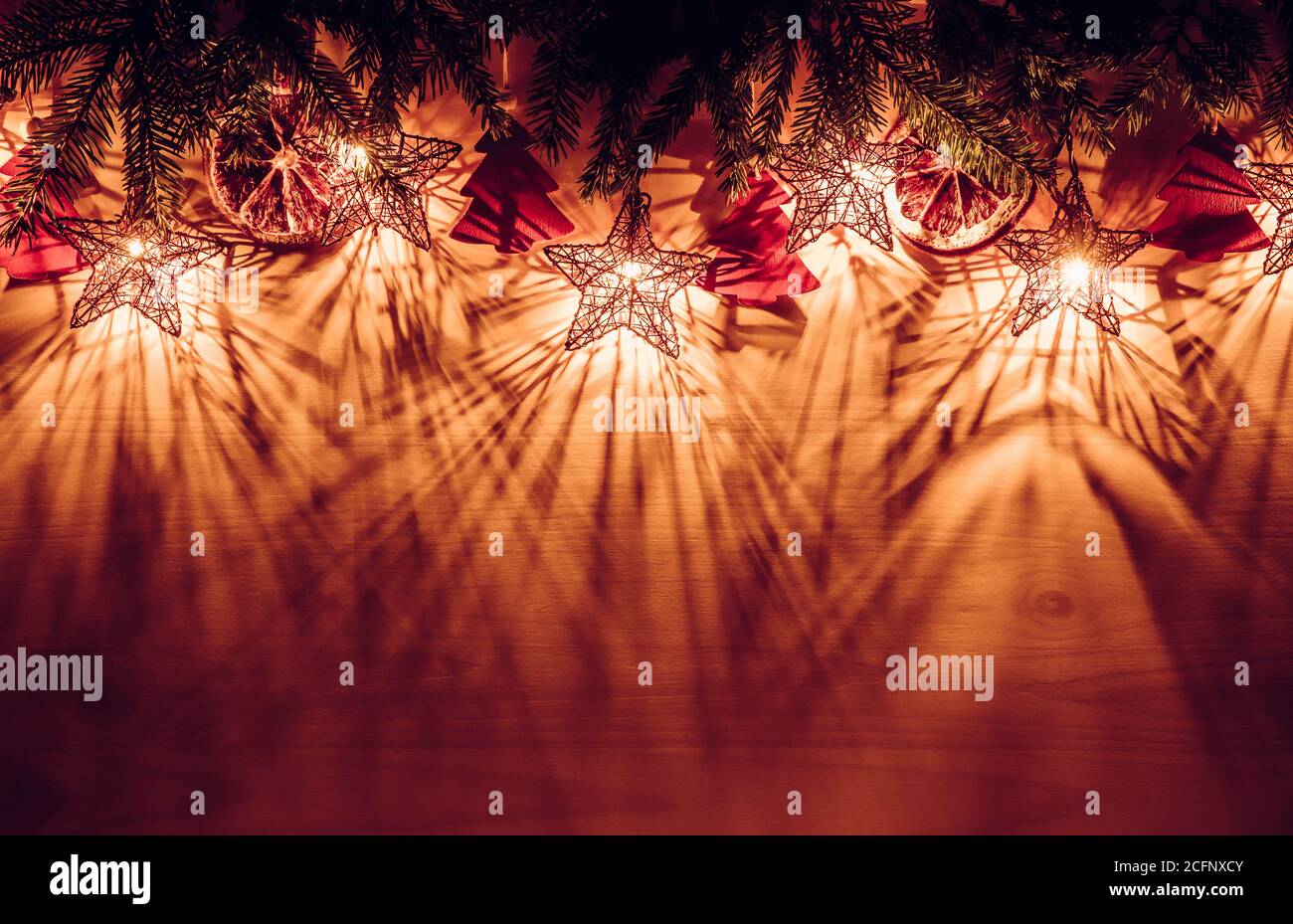 Christmas hygge background, upper border with spruce tree branches star ...