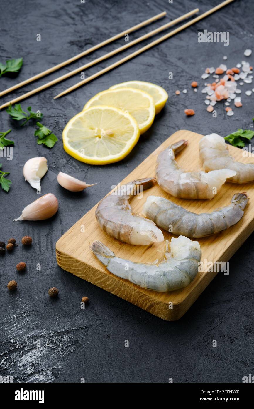 Composition with fresh raw prawn with spice and herbs Stock Photo - Alamy