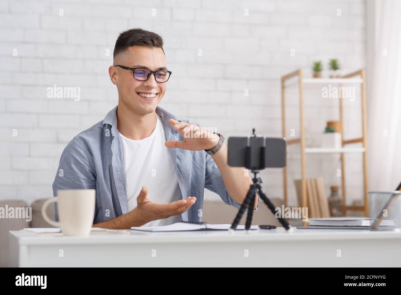 Work and study online during self-isolation. Man gestures and looks at ...