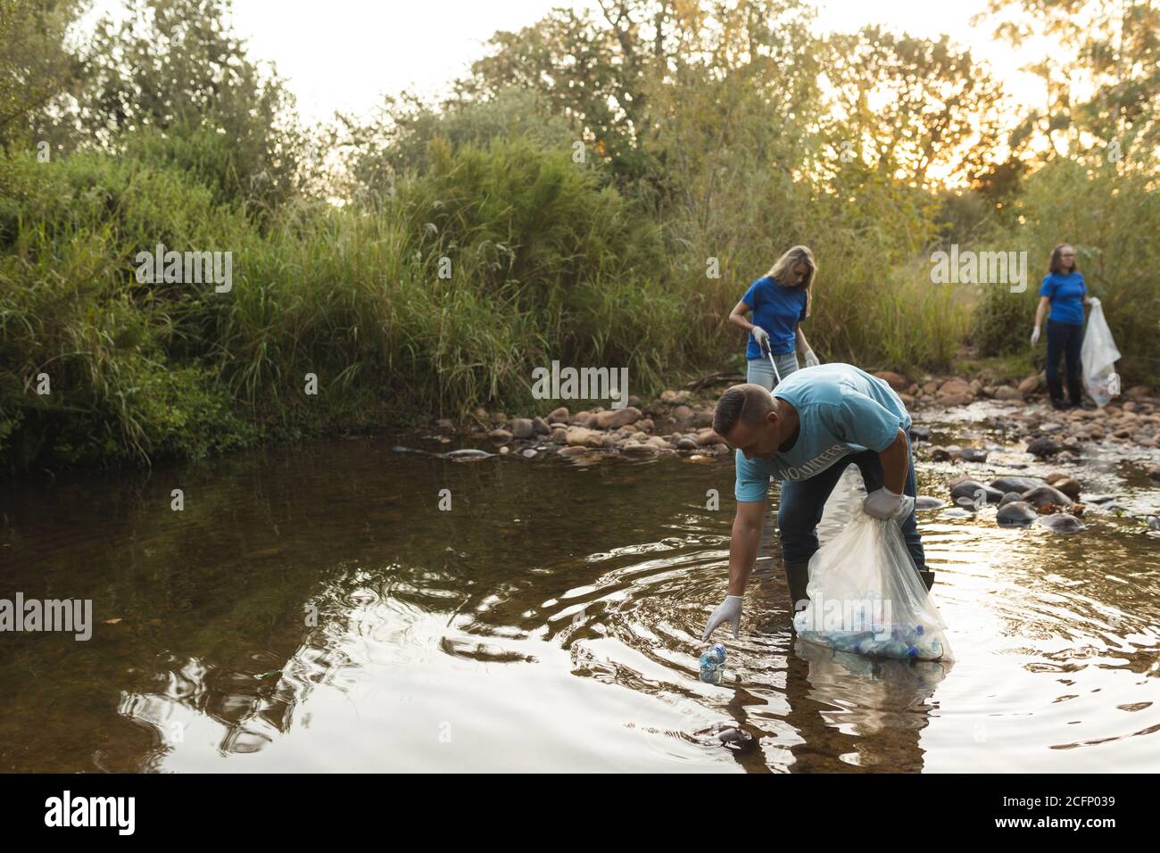 Volunteers cleaning up river Stock Photo - Alamy