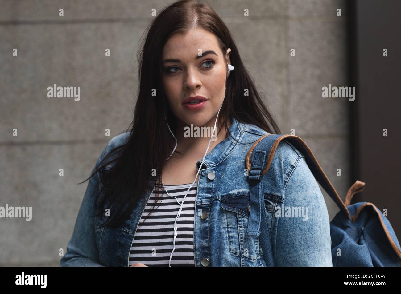 Curvy woman listening music hi-res stock photography and images - Alamy