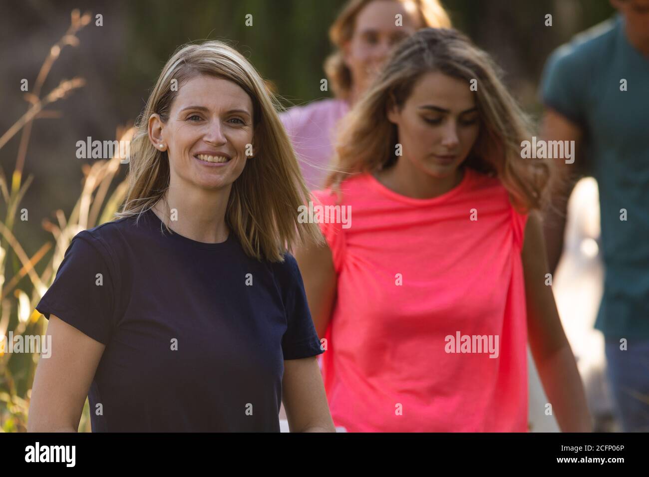 Volunteer smiling to camera Stock Photo - Alamy