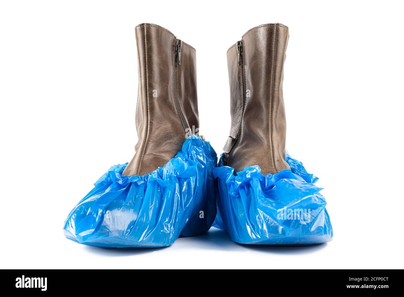 Blue protective shoe covers on female shoes isolated on white ...