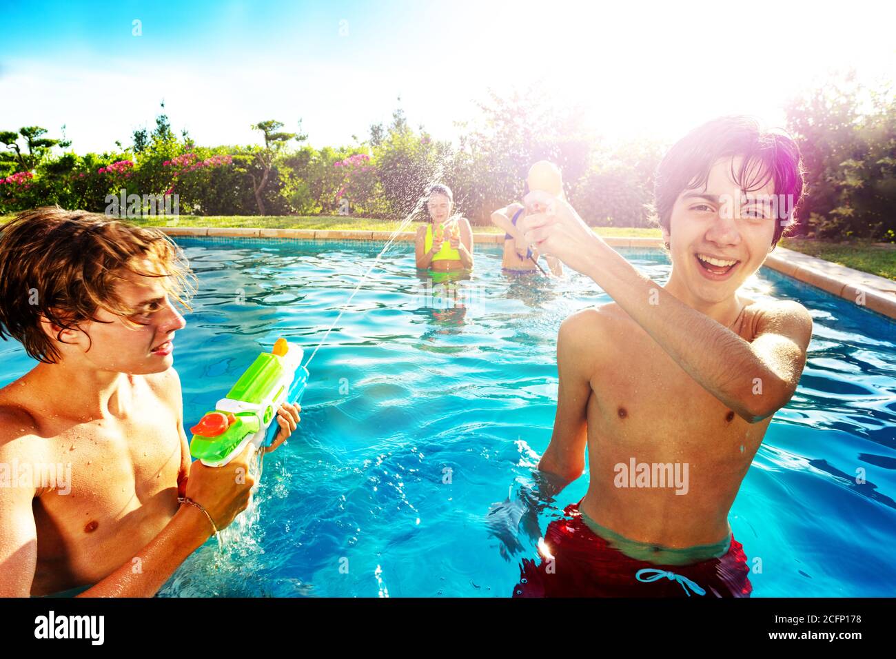 Friends Water Gun Fight High Resolution Stock Photography and Images ...