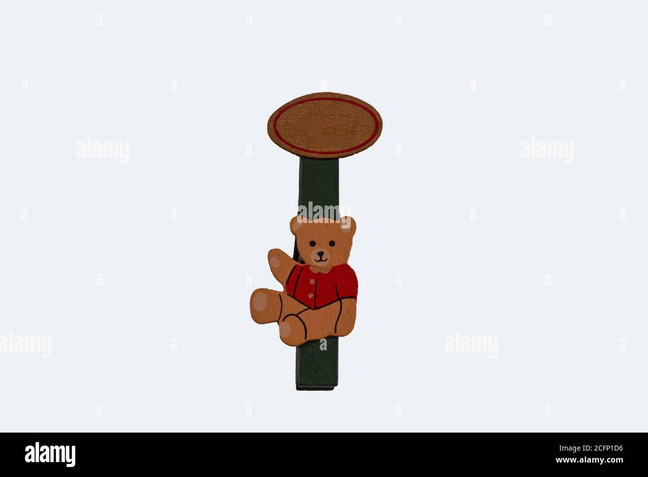 Close up of teddy bear symbol with writable sign isolated on white ...