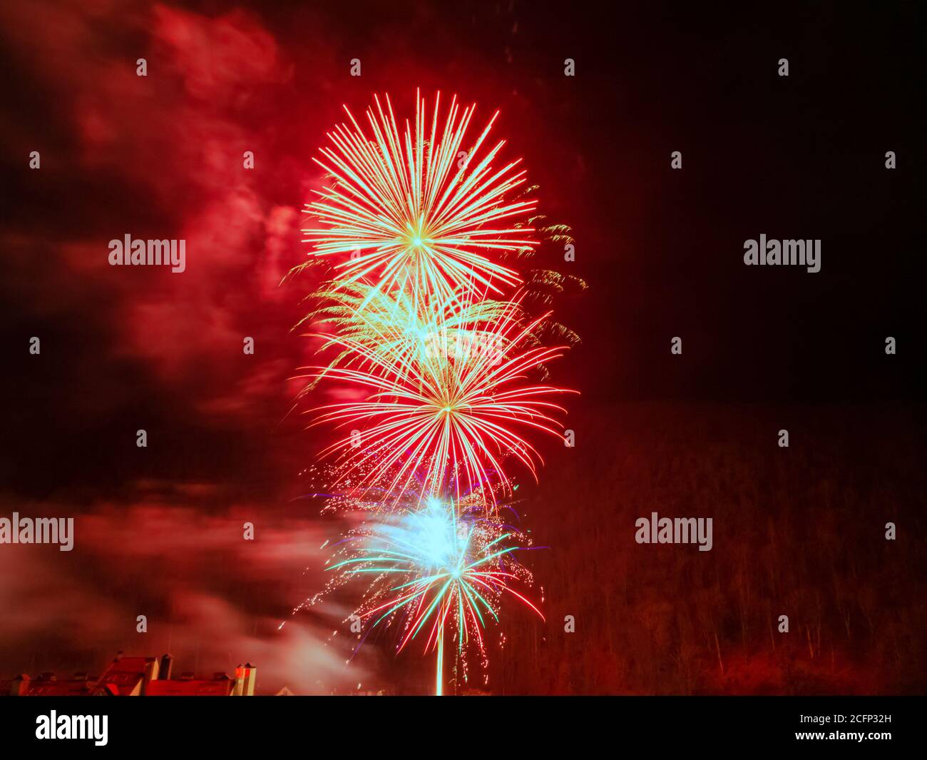 Bright flash of fireworks in red shades. Photo with filter Stock Photo ...