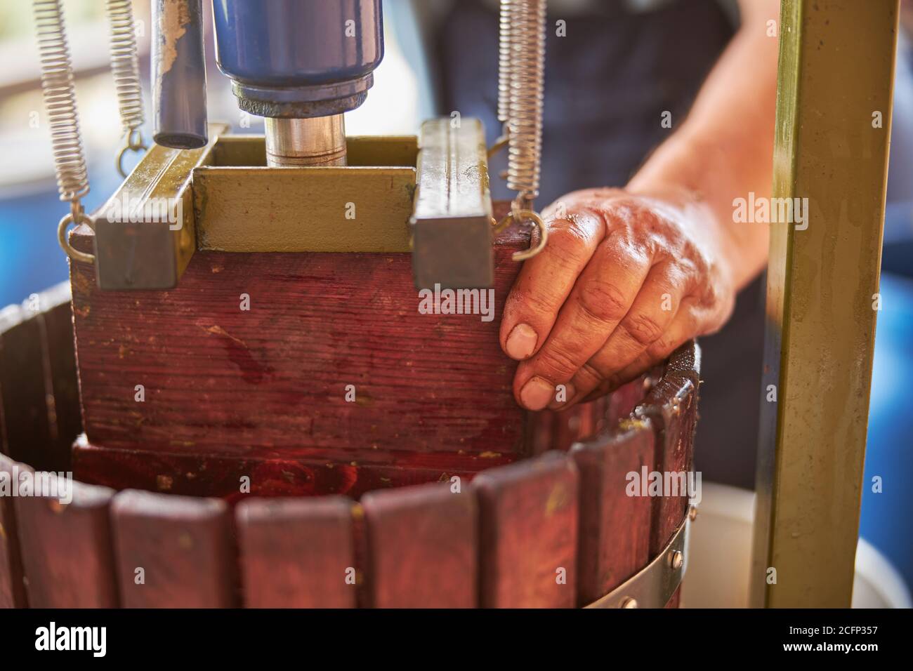 Wine press being used in the process of wine-making Stock Photo - Alamy