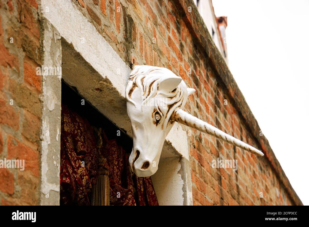 Unicorn head on building in Venice (Italy). Architectural detail Stock ...