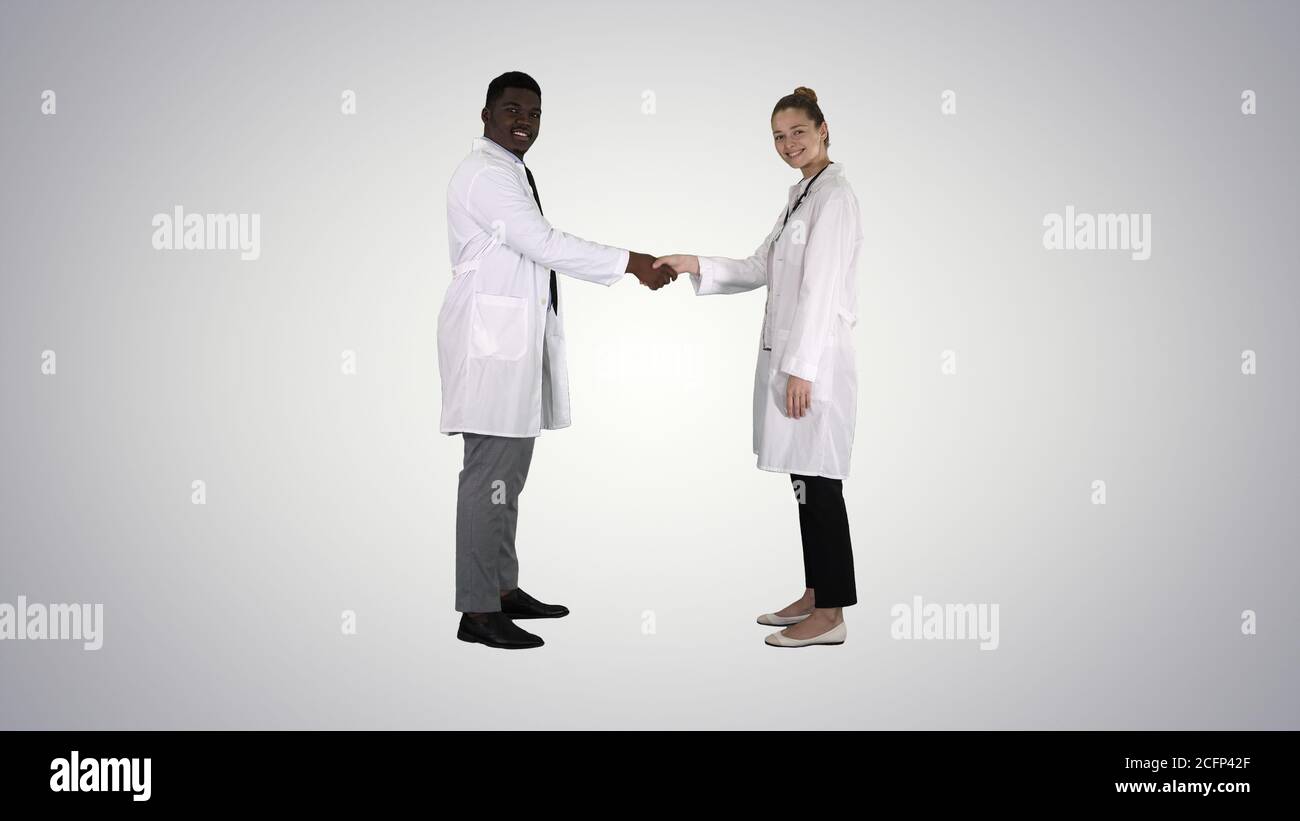Doctor nurse shaking hands in hi-res stock photography and images - Alamy