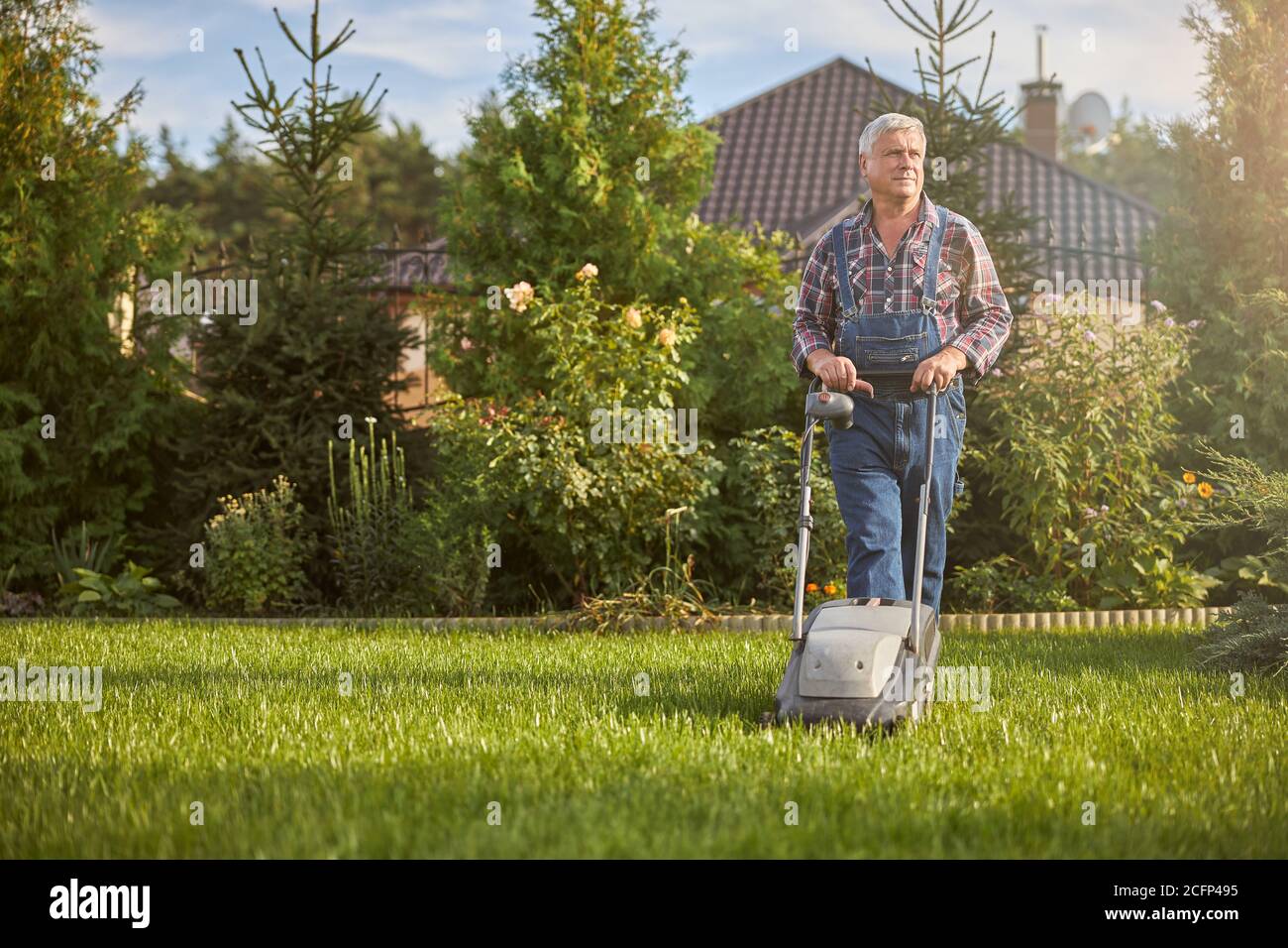 Using electric mower hi-res stock photography and images - Alamy