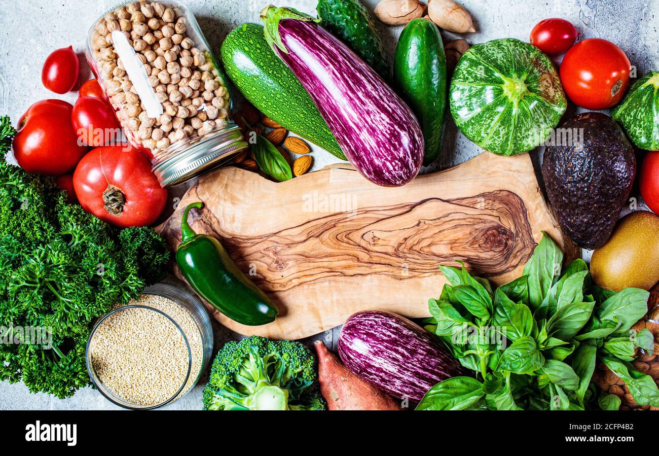 Cooking healthy food background. Raw fresh vegetables, legumes, cereals ...