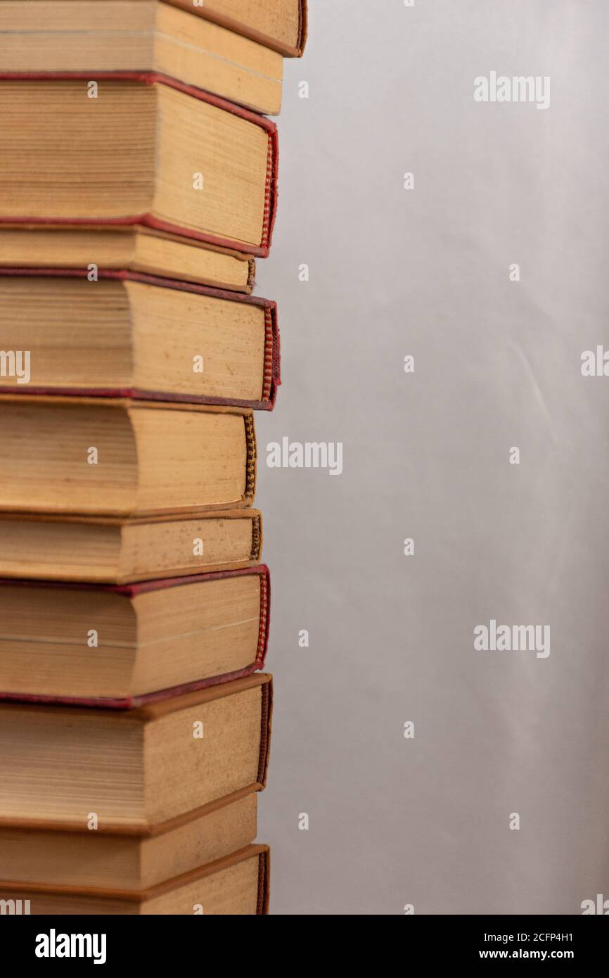 Background with piled up old books Stock Photo - Alamy