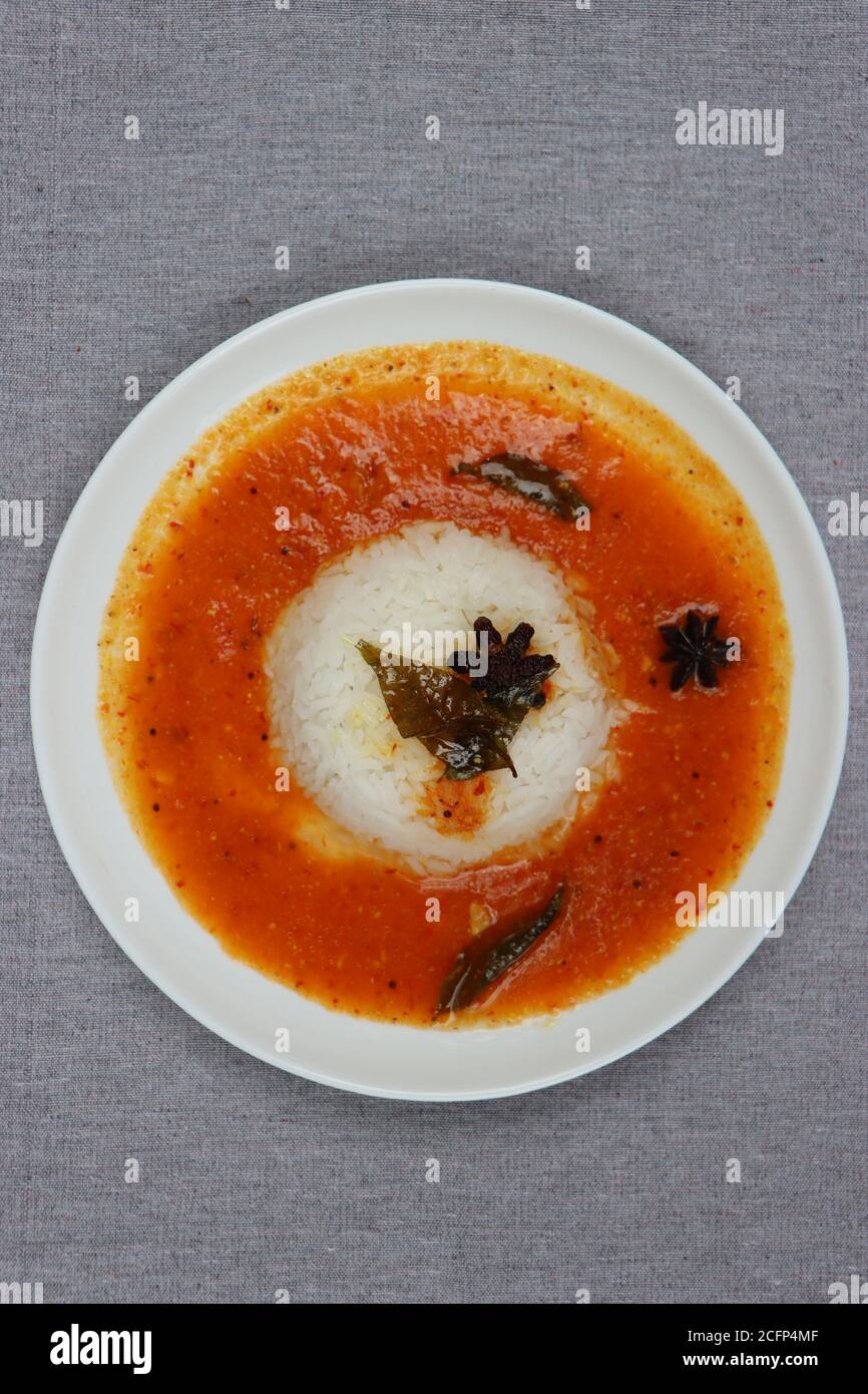 Tomato curry served with rice, goa or western maharashtra food, served ...