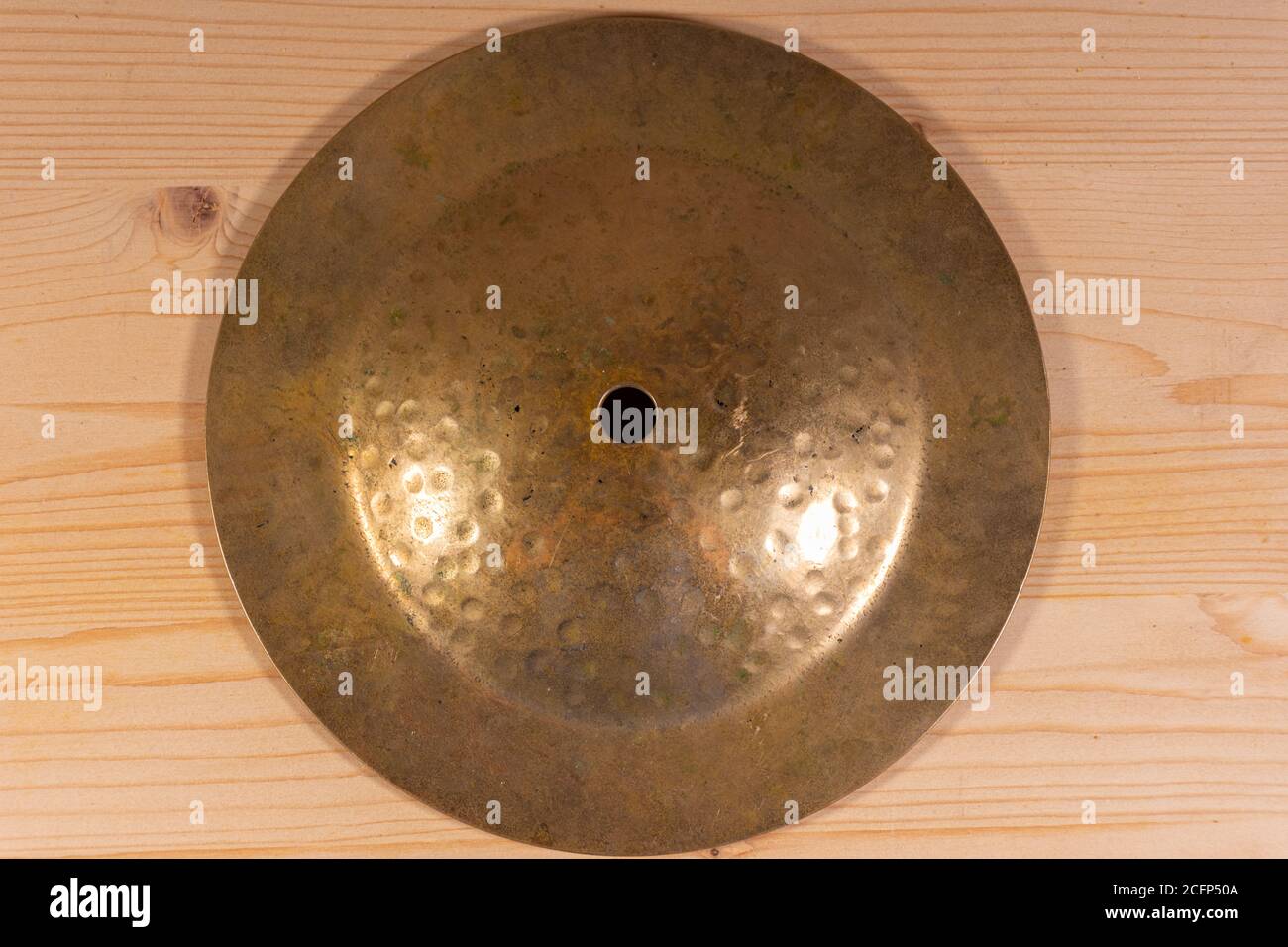 Close up of a bronze musical cymbal. Concept of metal processing Stock ...