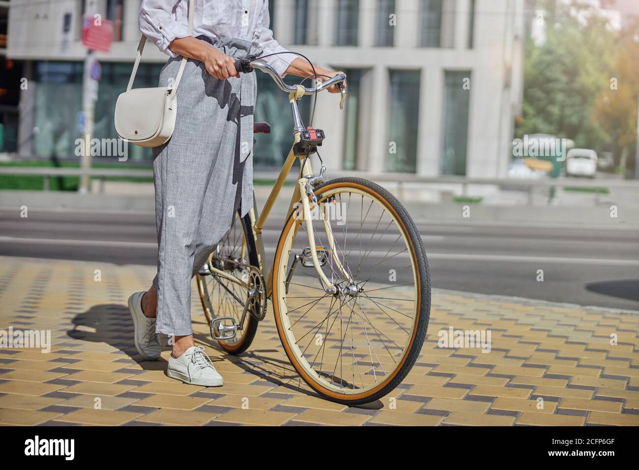 Female tourist walking in the famous place of city with bike Stock ...