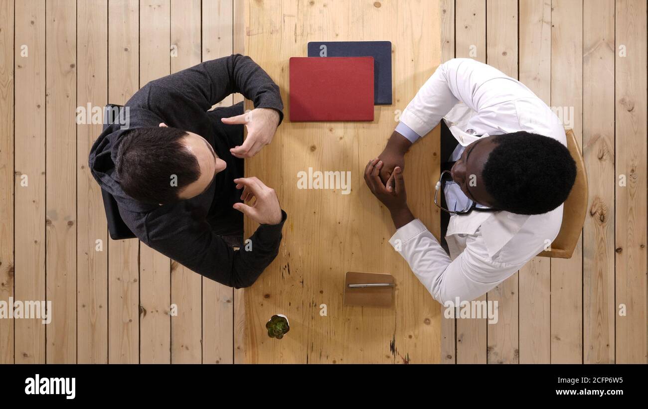 Patient telling doctor about his problem. Doctor makes suggestions ...