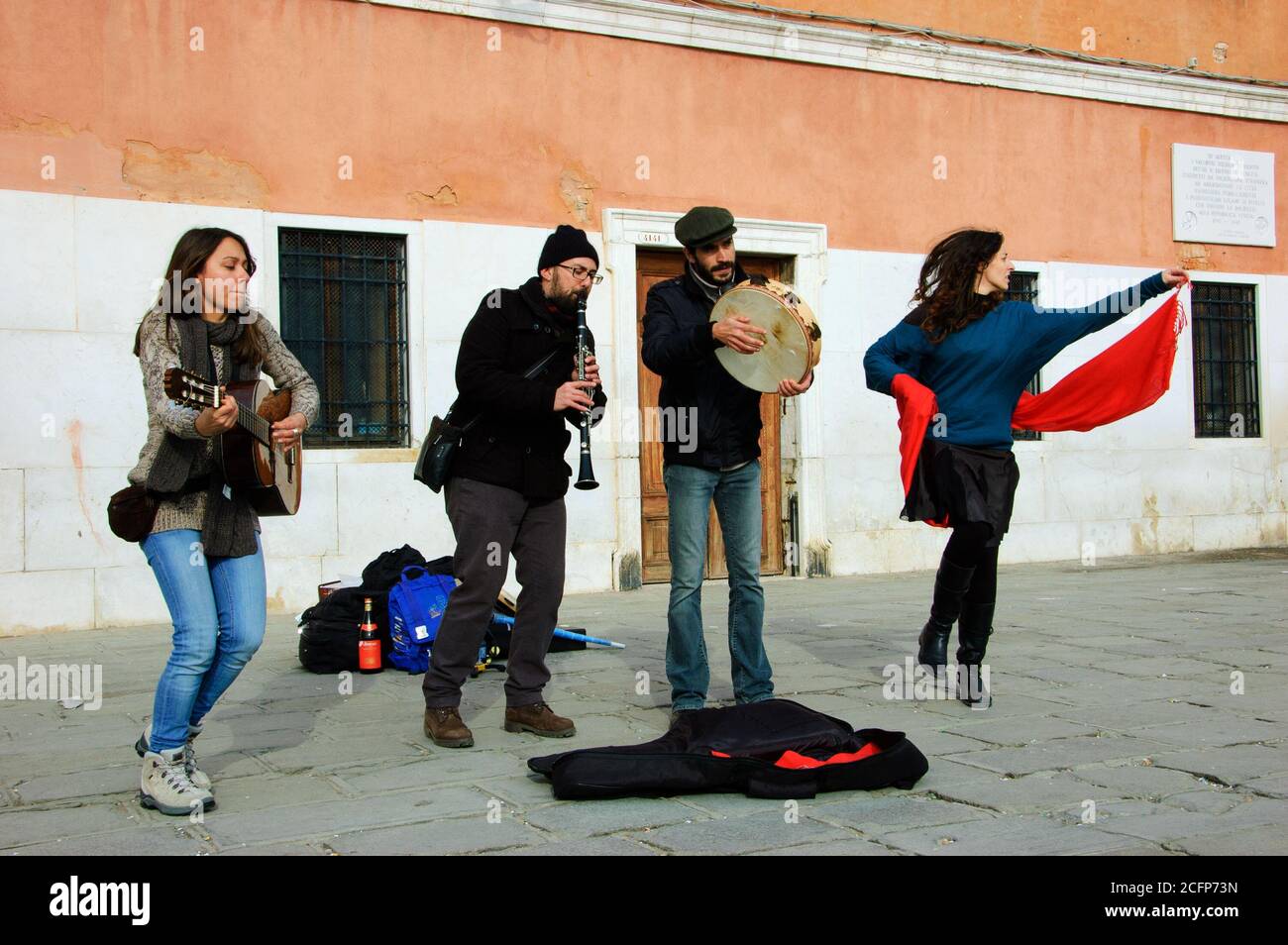 VENICE, ITALY - FEBRUARY 14, 2015: Street musicians play Italian folk ...