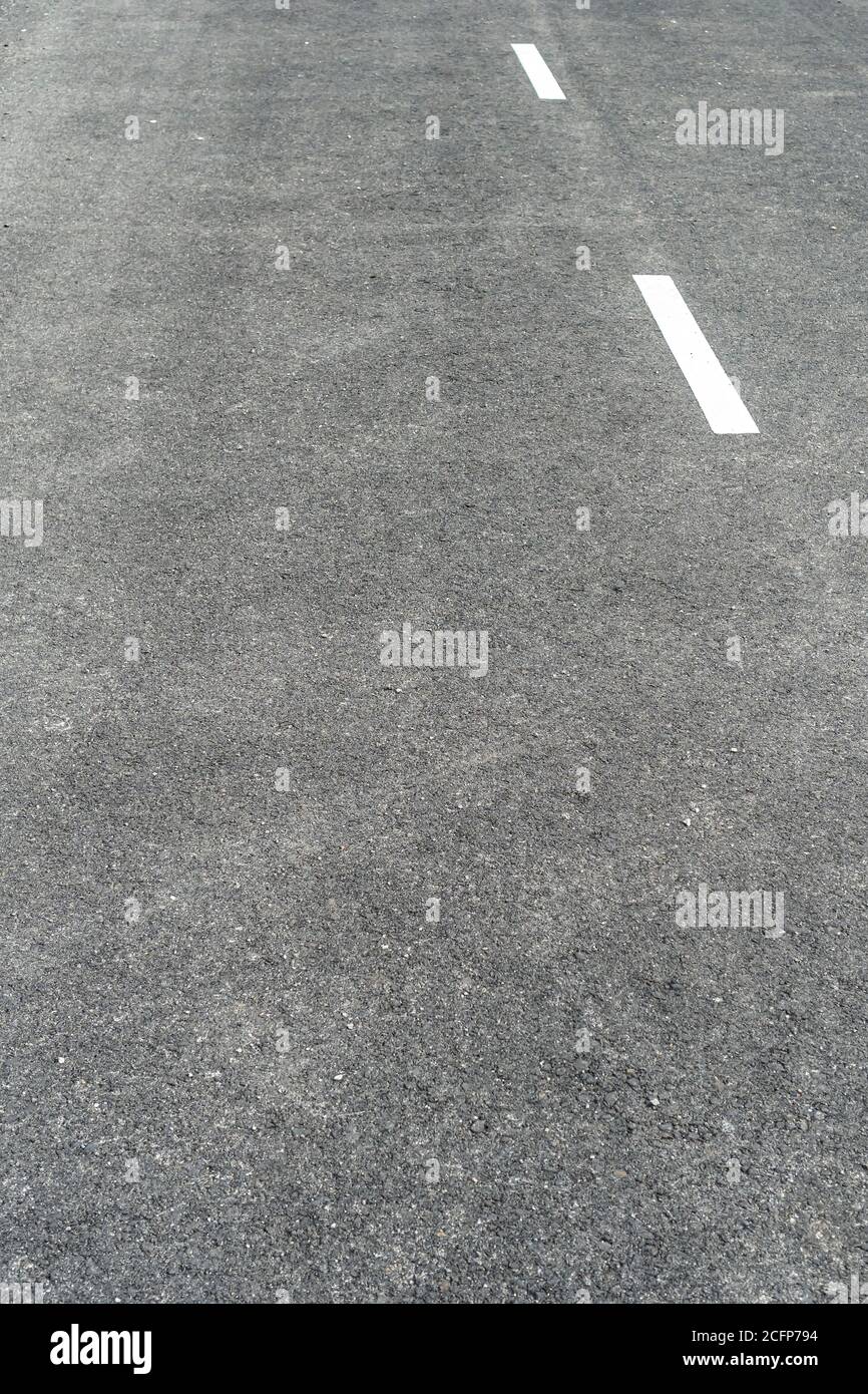 Dark Gray Asphalt with White Road Marking Lines. Abstract background ...