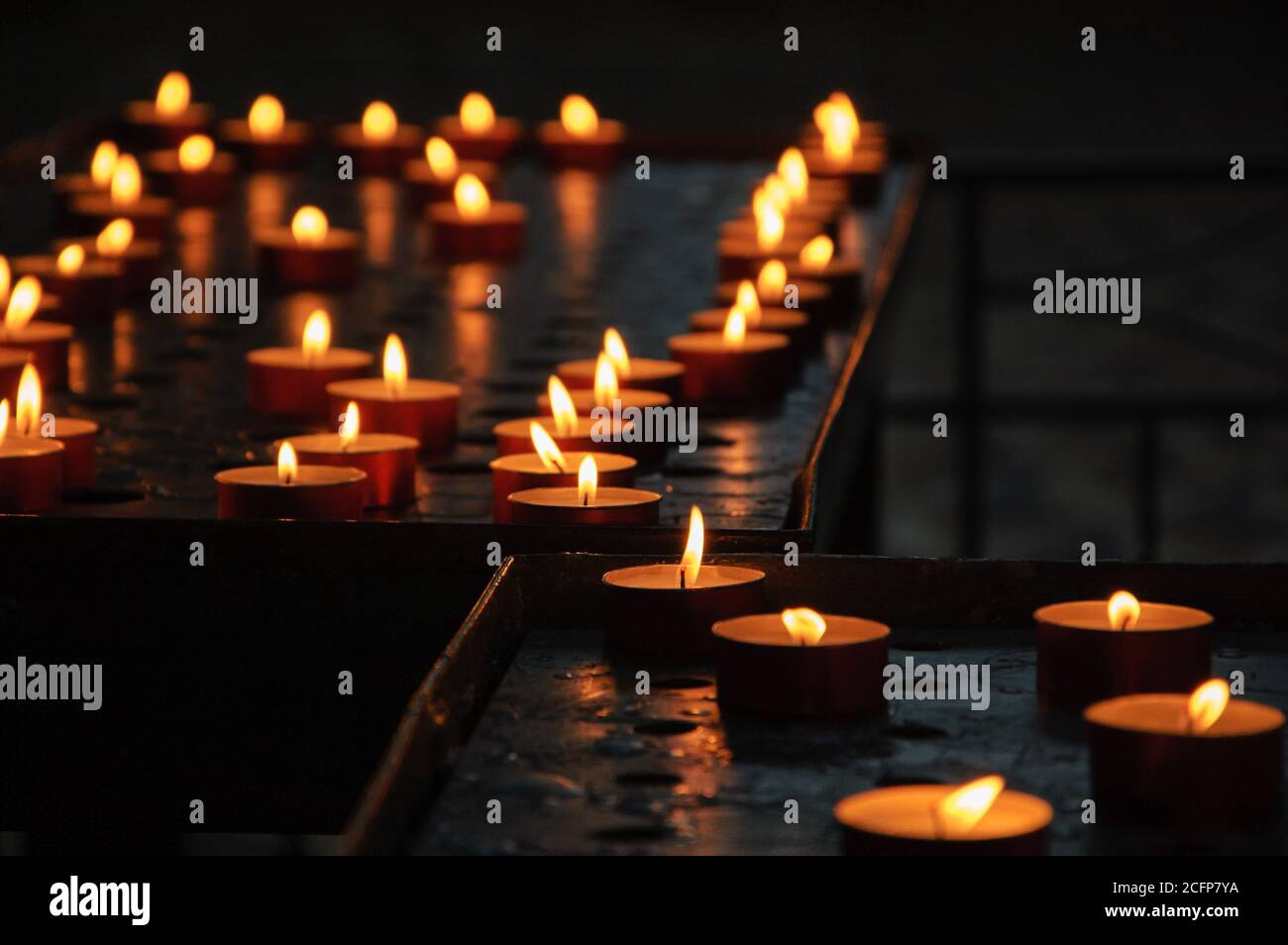 Burning candles in vintage candlesticks hi-res stock photography and ...