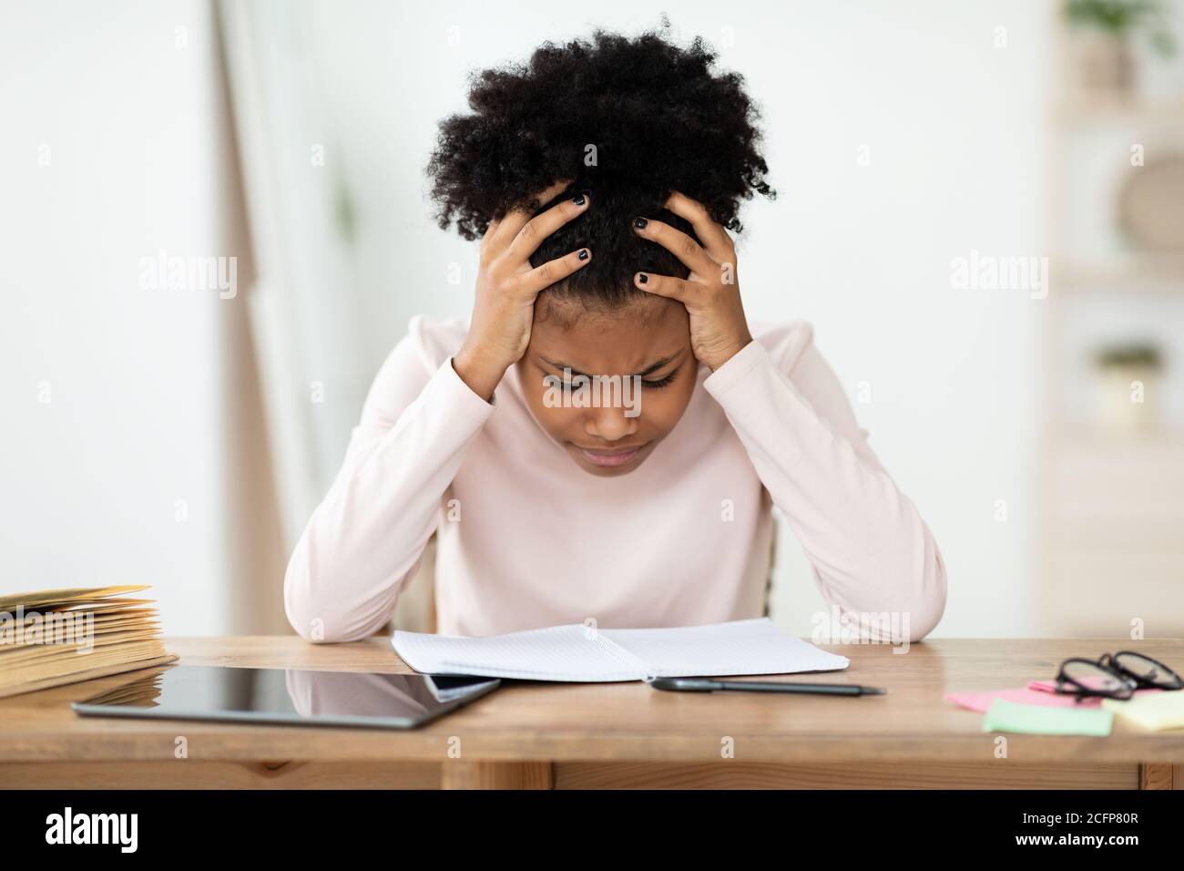 African teen homework sad hi-res stock photography and images - Alamy
