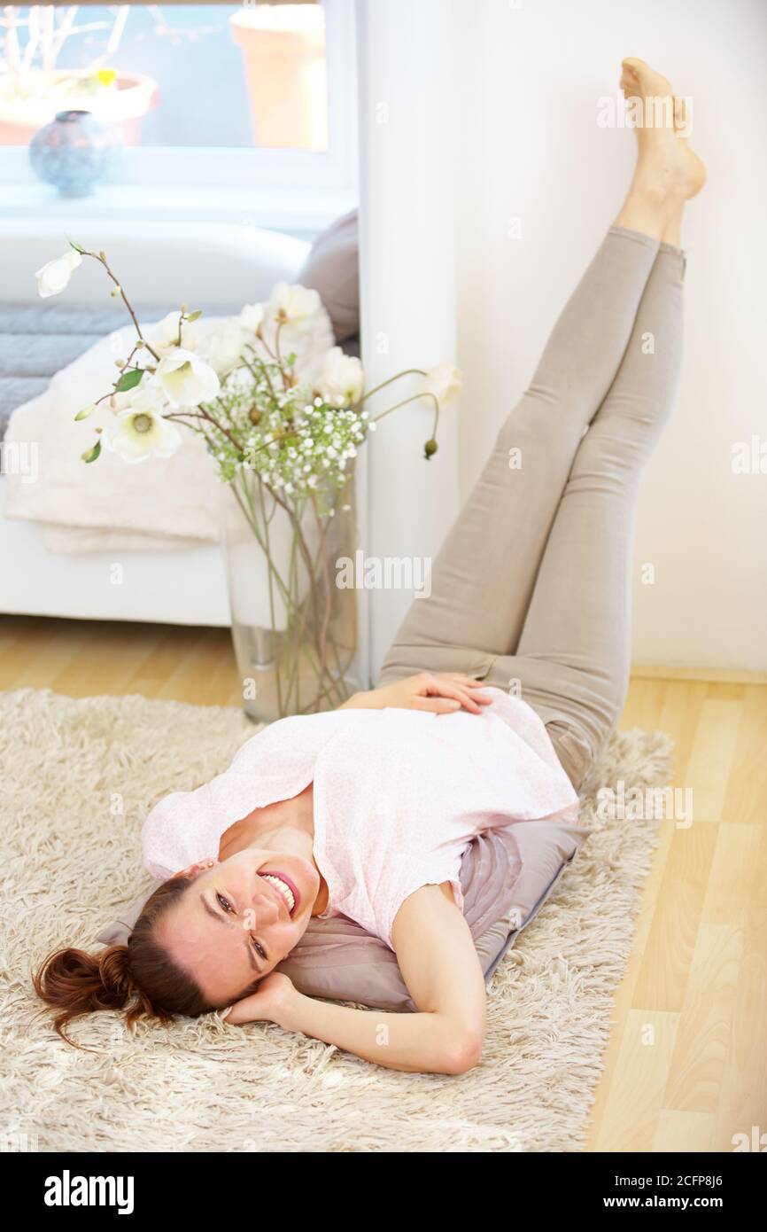 Woman relaxed feet up hi-res stock photography and images - Alamy