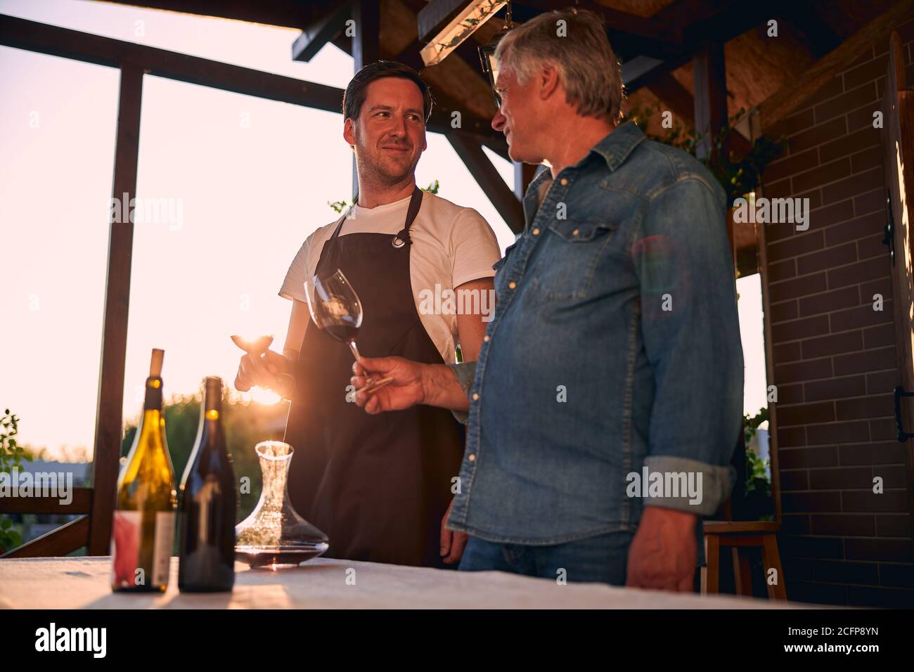 Skilled sommeliers on the terrace of their winery Stock Photo - Alamy