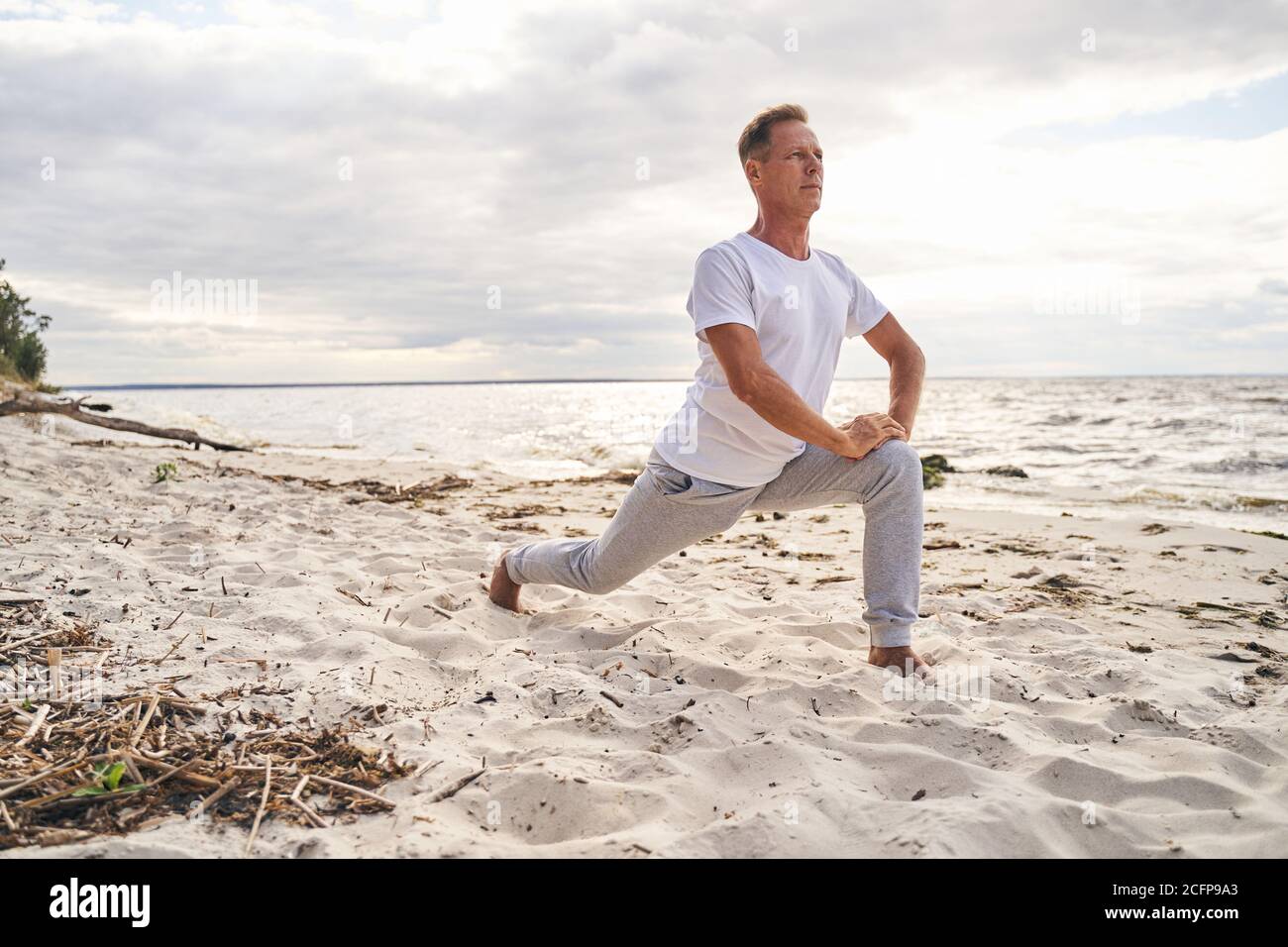 Lean man starting morning with training outdoors Stock Photo - Alamy