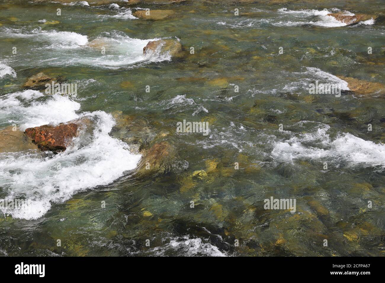 Muota river with clear fresh water flows in the Muota Valley ...