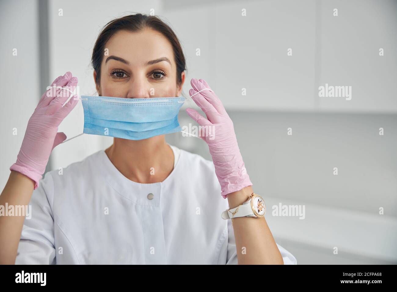 Professional female dermatologist getting ready for work Stock Photo ...