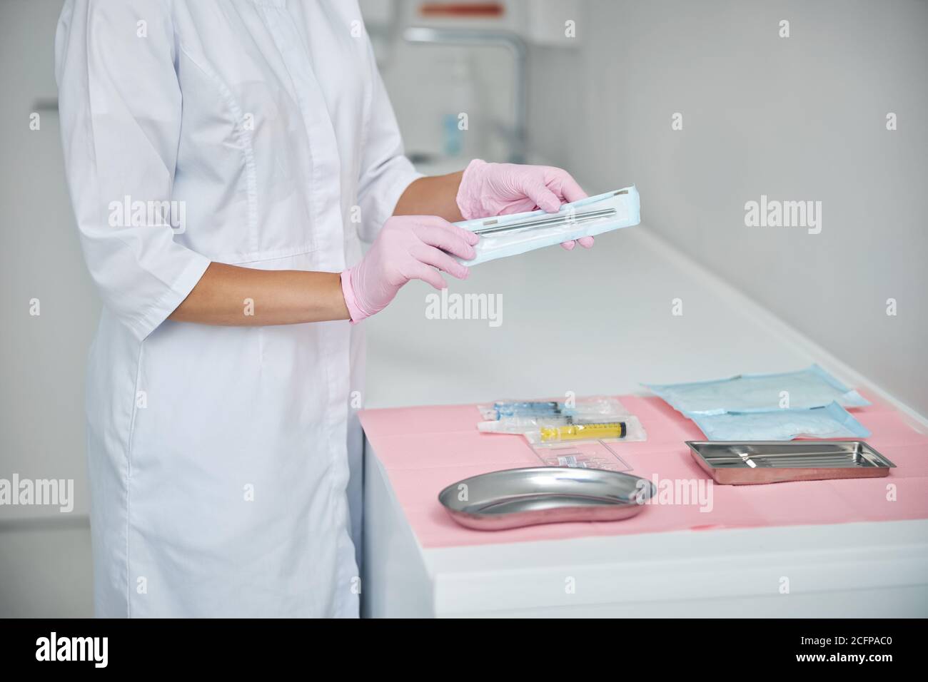 Female doctor with stainless steel surgical tools Stock Photo - Alamy