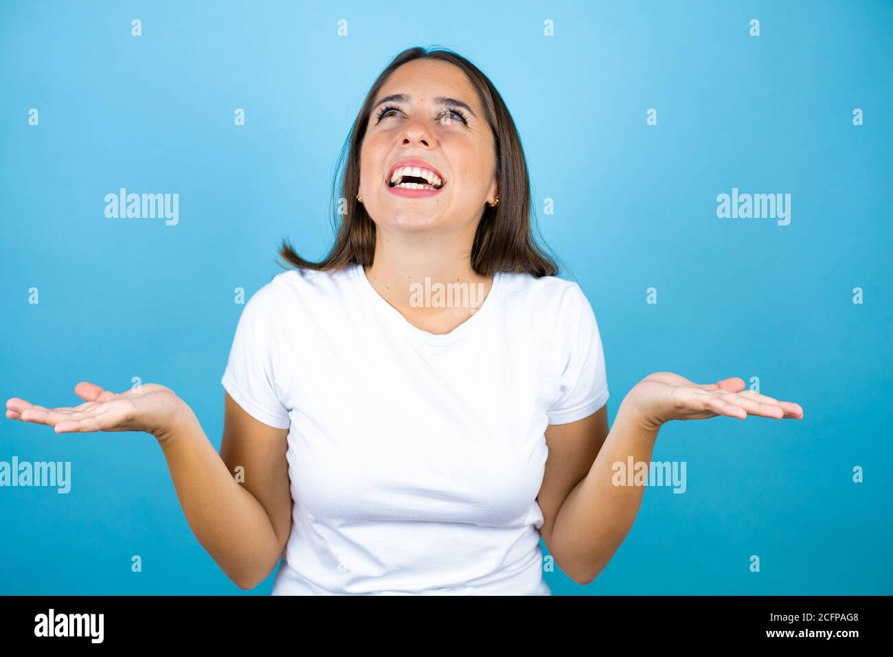 Woman face shrug raised hands hi-res stock photography and images - Alamy