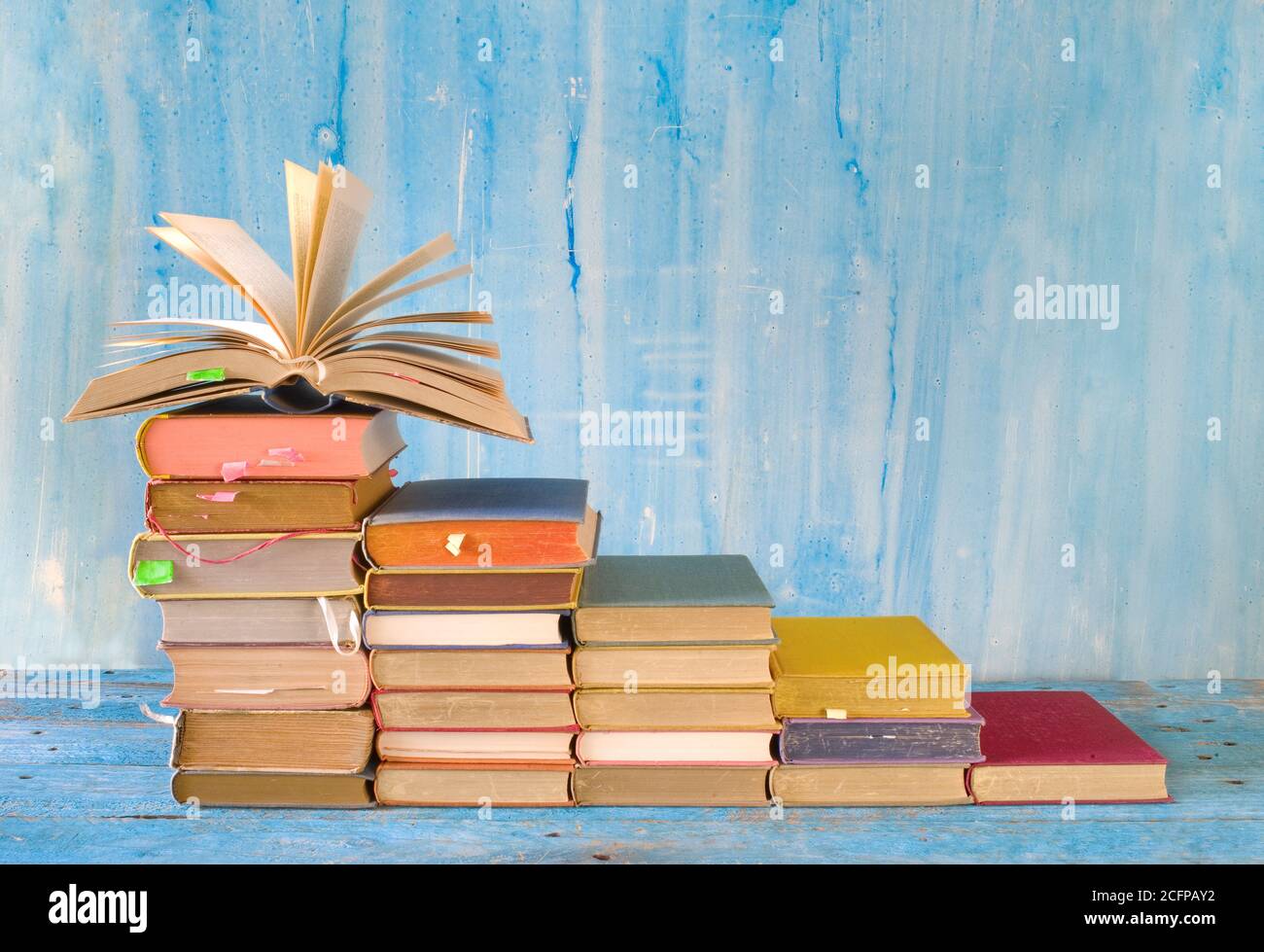 Stack of books and an open book. Reading,literature,education,library ...