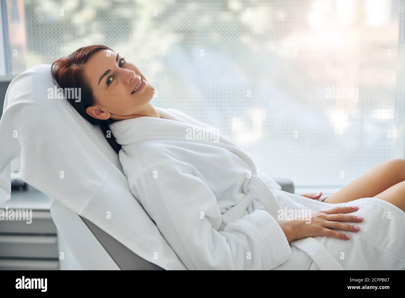 Smiling spa client posing for the camera Stock Photo - Alamy