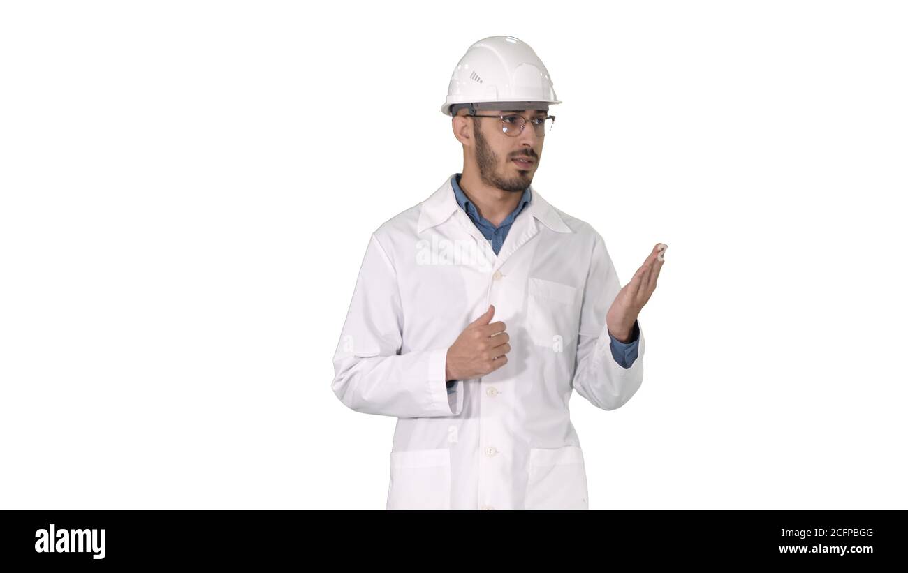 Scientist in white robe and helmet presenting pointing to side with ...