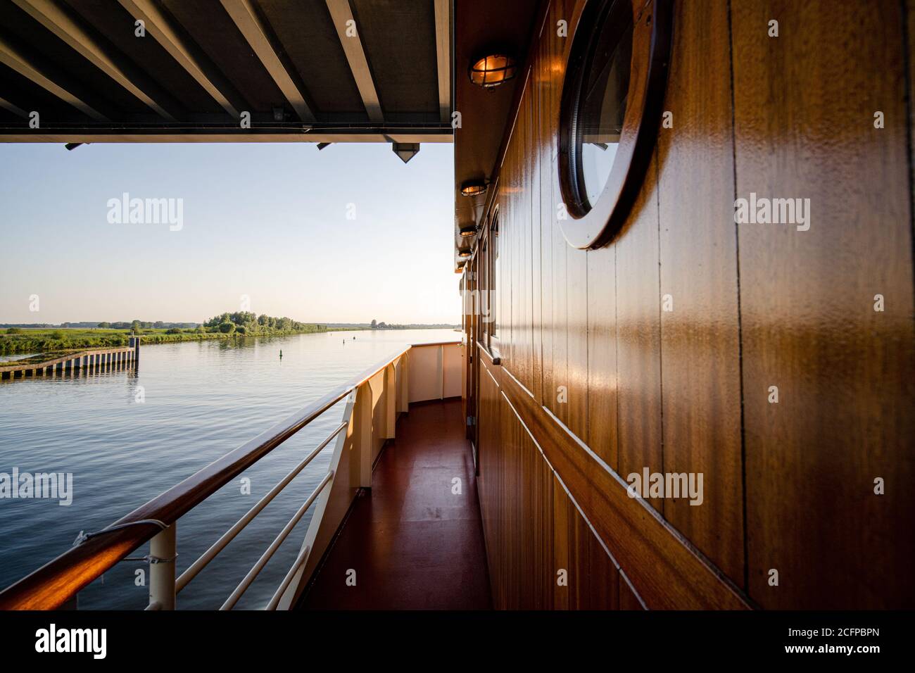 Wheelhouse with vintage wooden upholstery and burning ship's lights ...