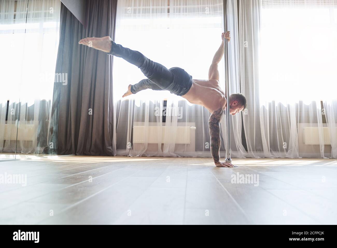 Male pole dancer hi-res stock photography and images - Alamy