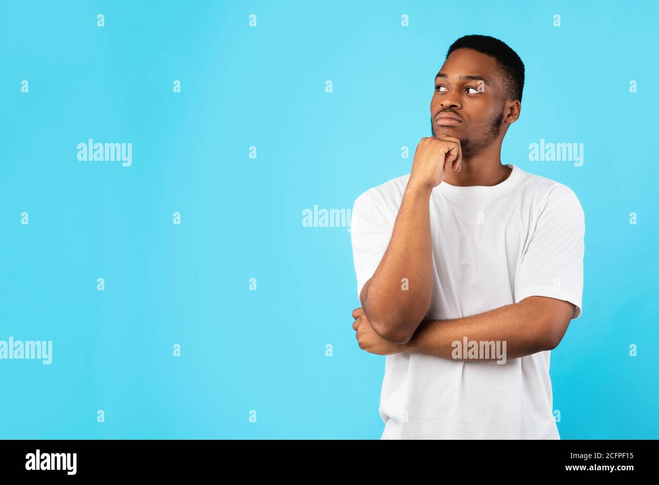 Thoughtful African Man Thinking Looking Aside Posing Over Blue ...