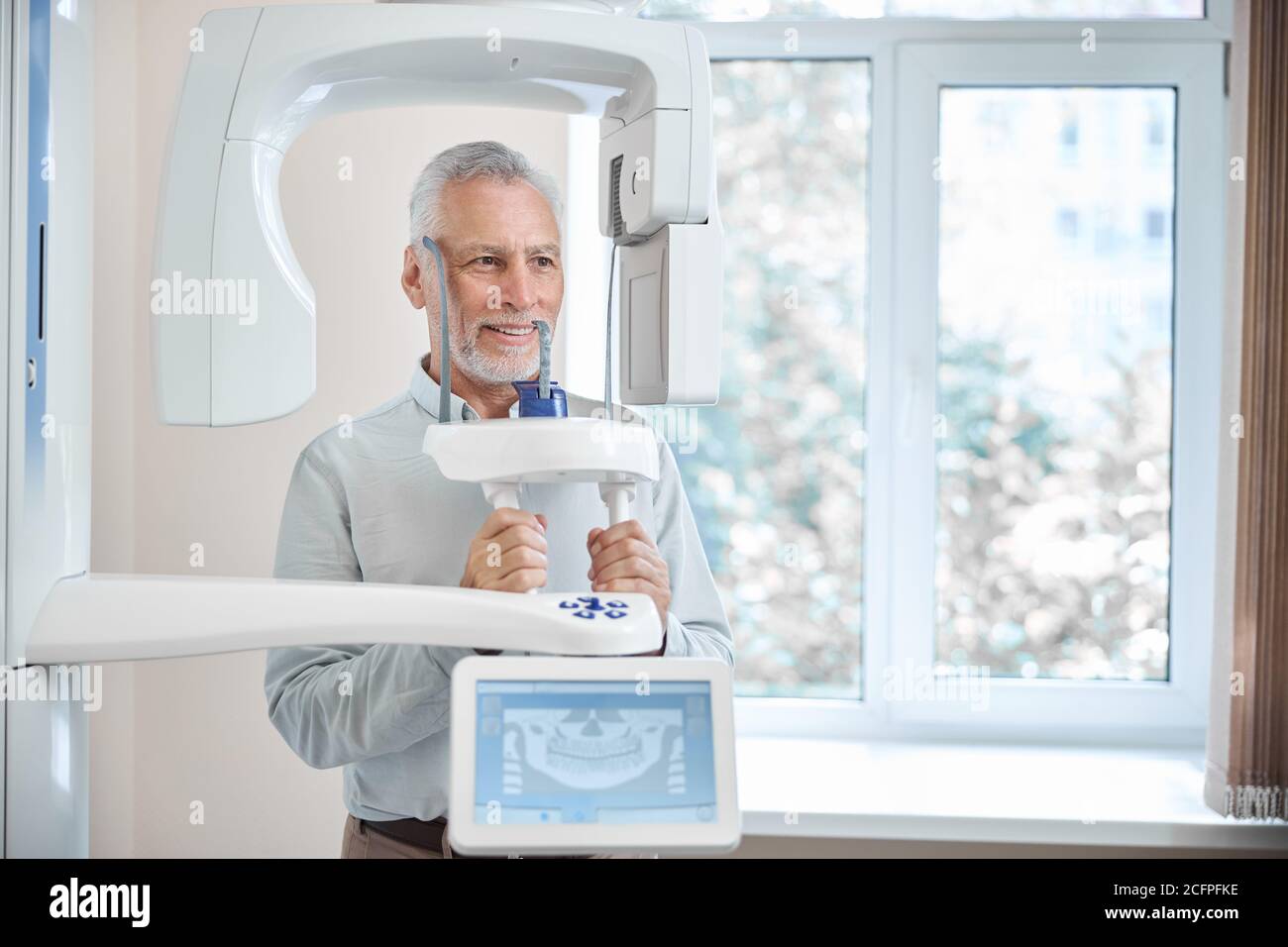 Elderly patient getting a panoramic dental x-ray Stock Photo - Alamy