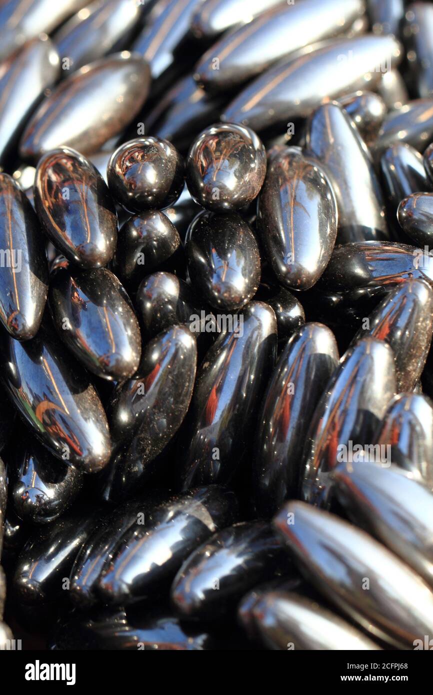 hematite mineral background (small shiny elipses texture Stock Photo ...