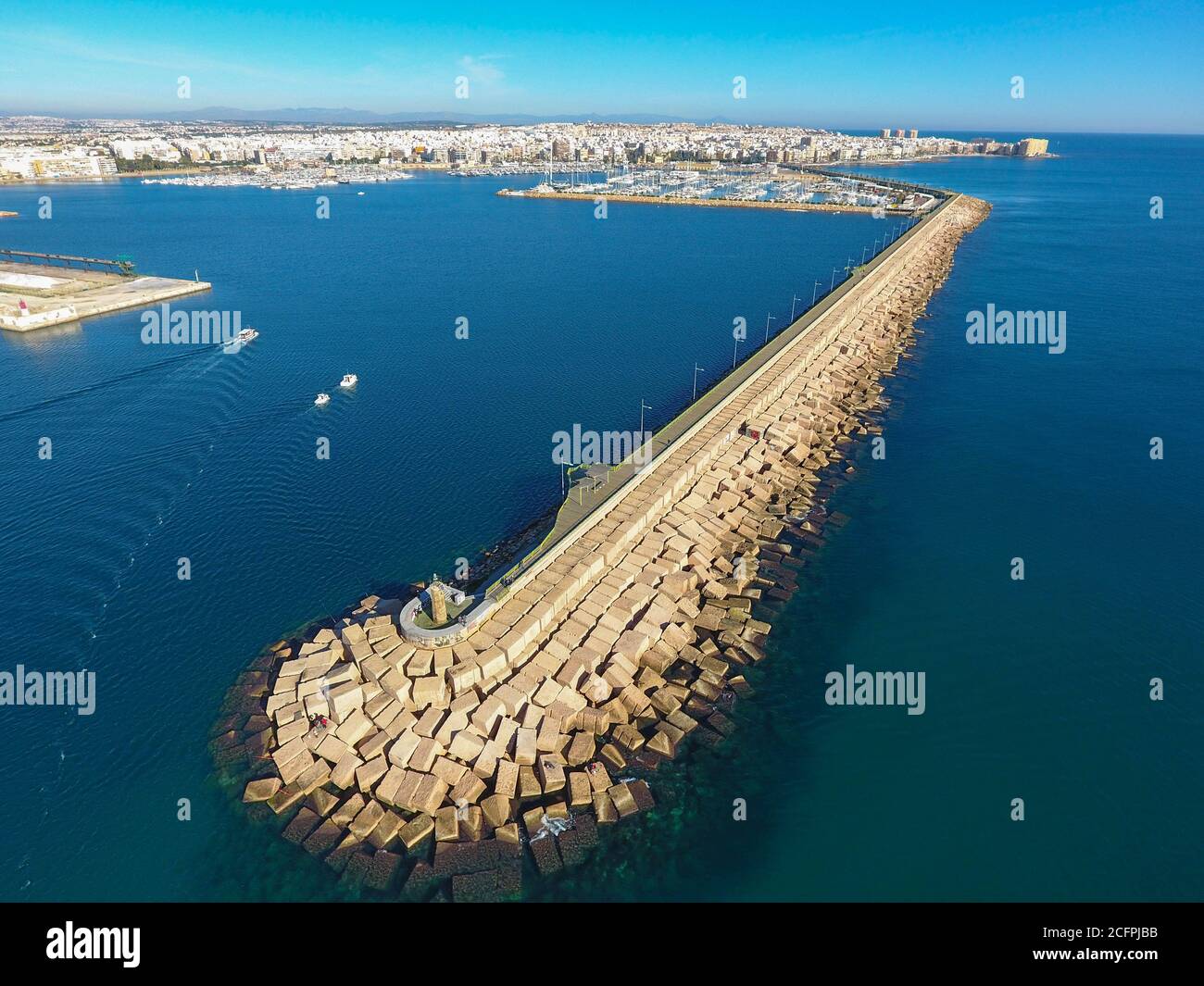 lighthouse at the entrance to the port Stock Photo - Alamy