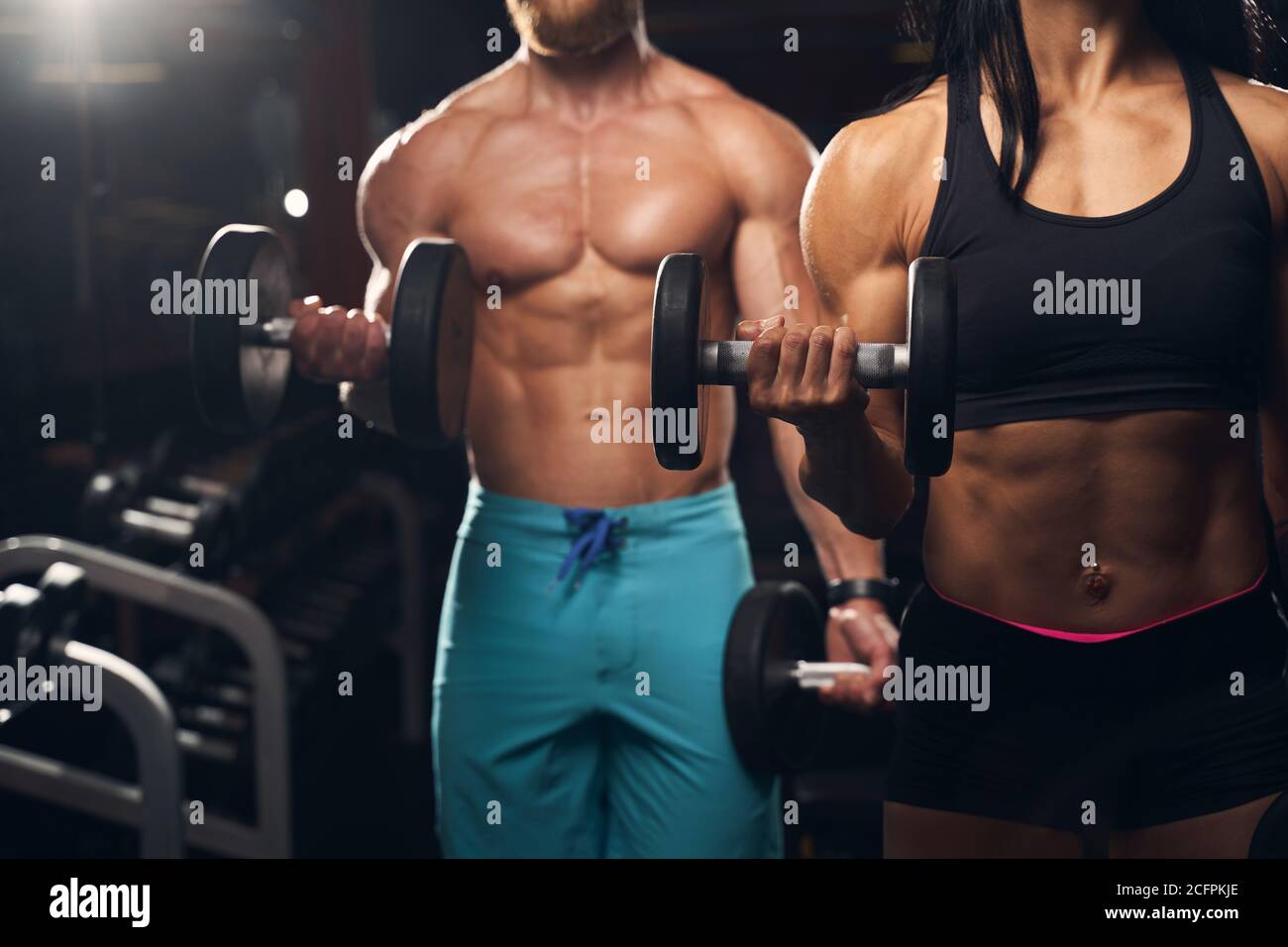 Two athletic people working out at the gym Stock Photo - Alamy