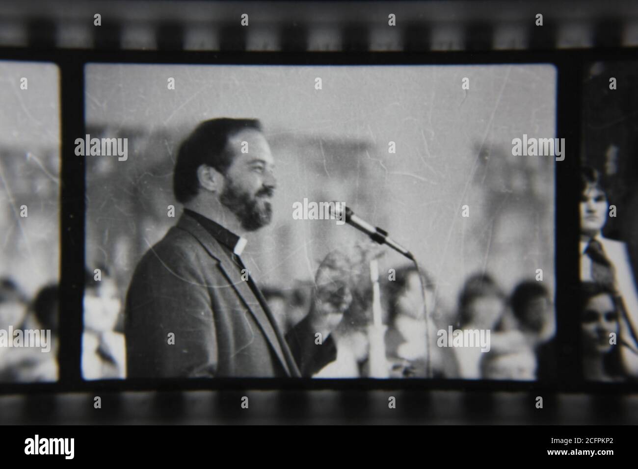 Fine 1970s vintage black and white photography of a priest speaking in ...